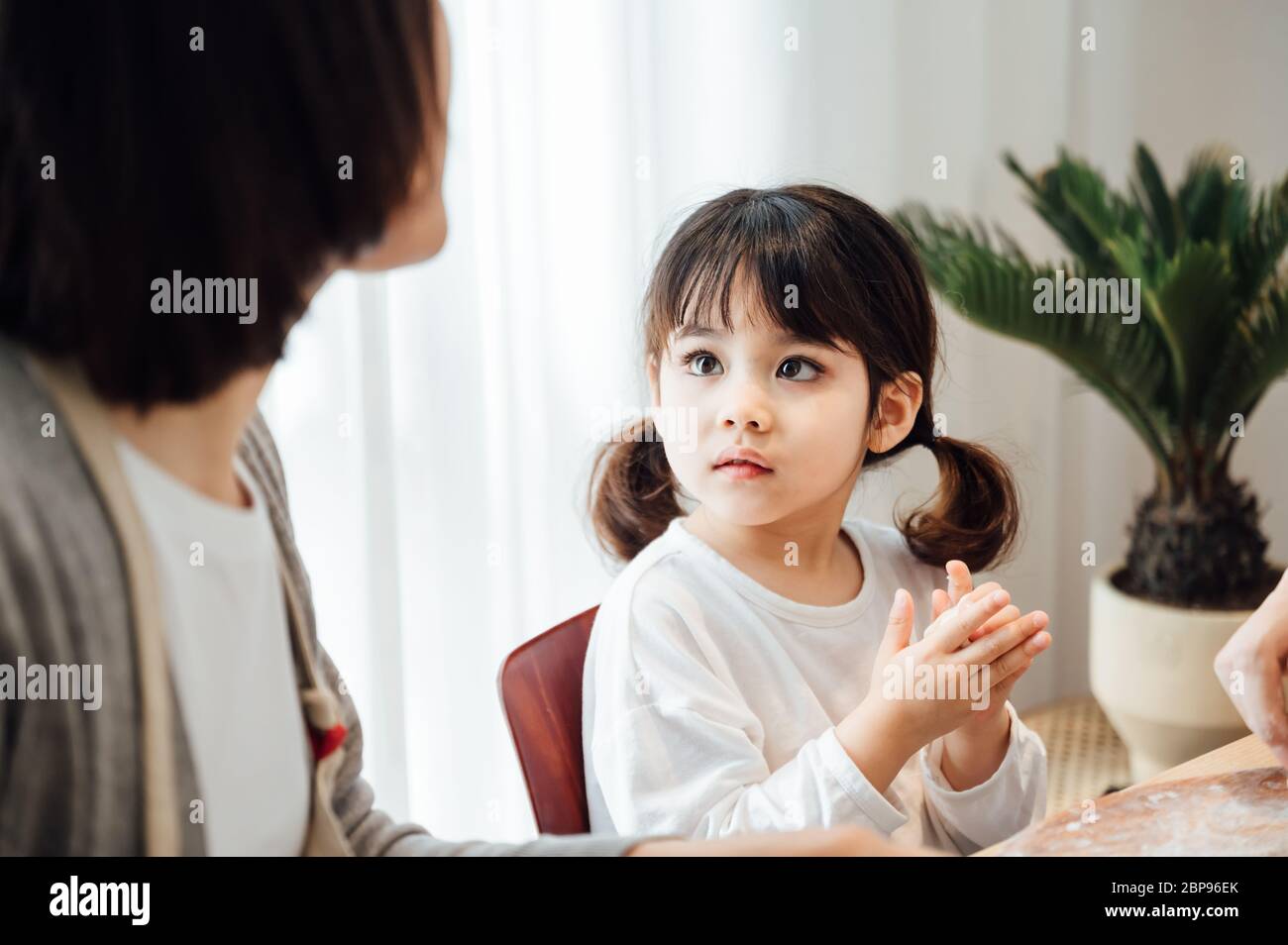 Mom and Dad and daughter at home dumplings Stock Photo - Alamy