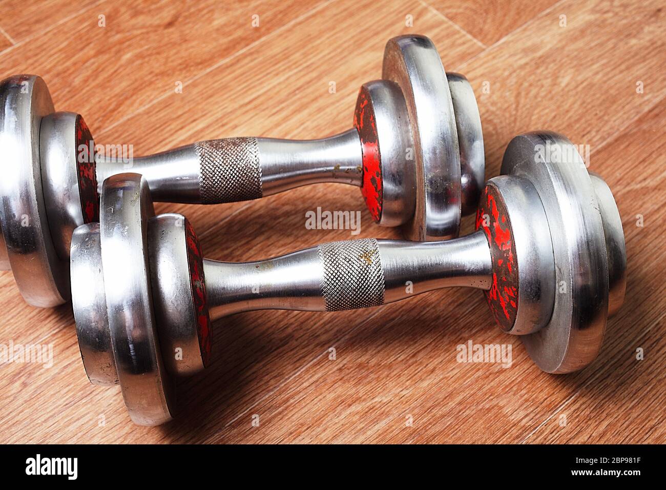 Two dumbbells on wooden hi-res stock photography and images - Alamy