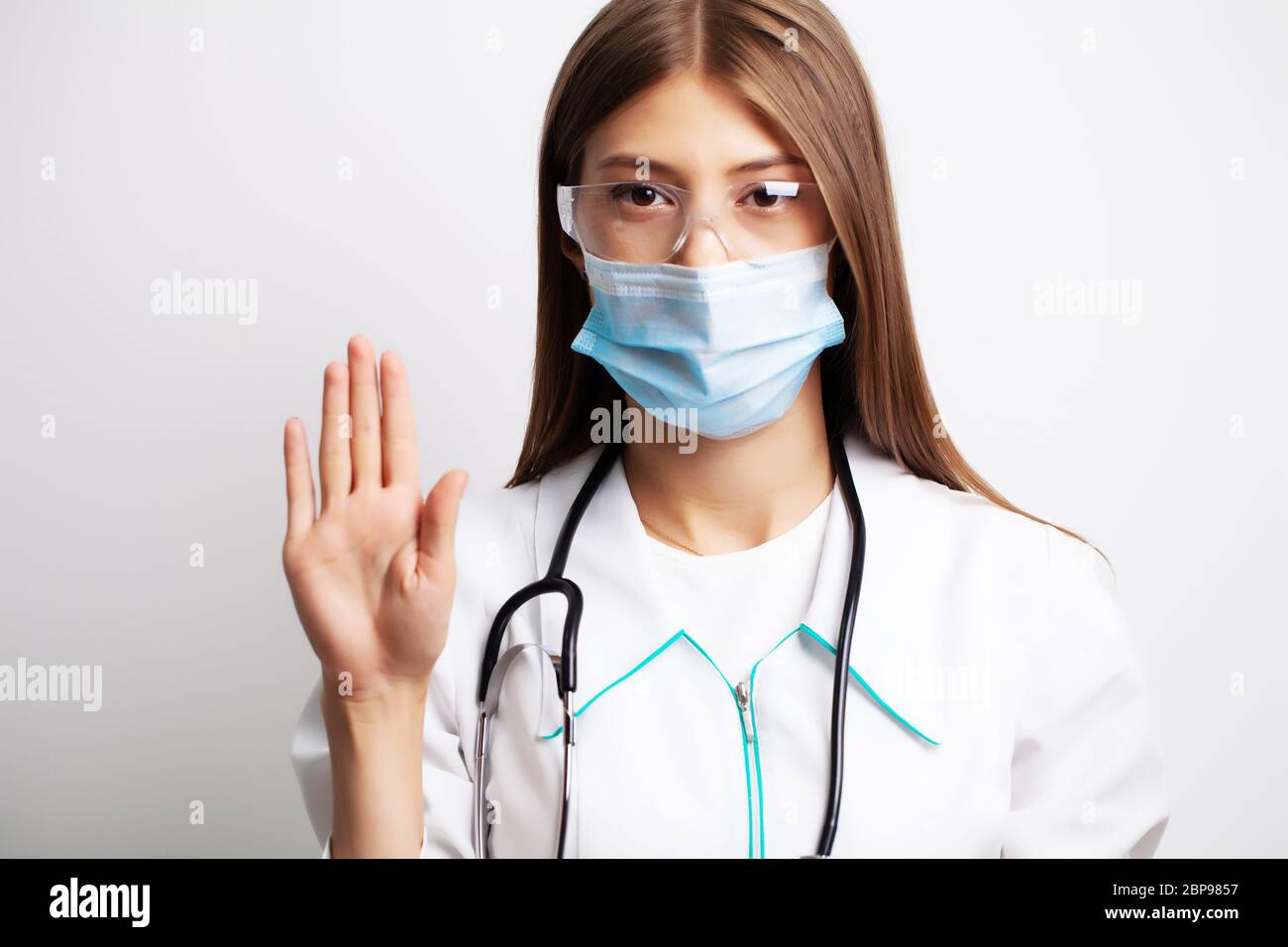 Doctor showing hand stop gesture, health safety concept Stock Photo - Alamy