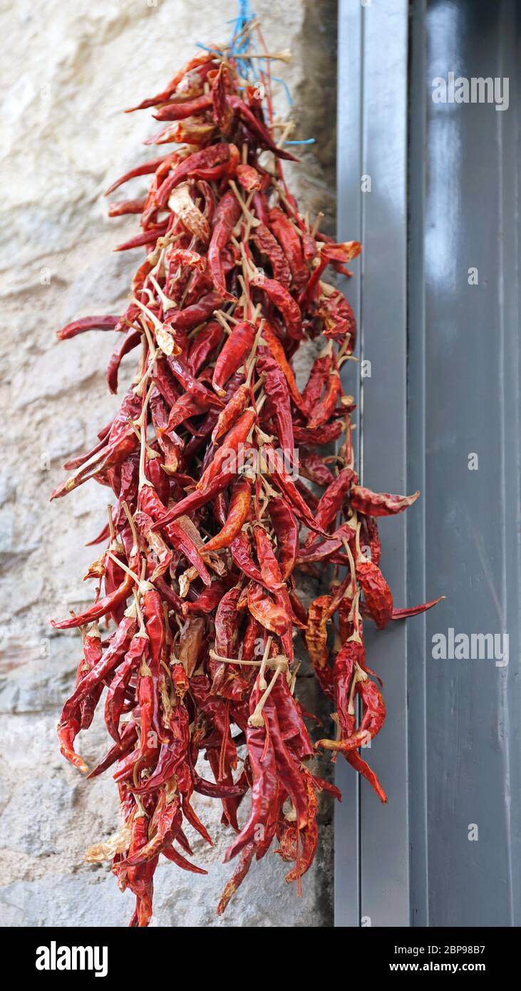 Dried Chili Pepper Hanging at Outside Wall Stock Photo - Alamy