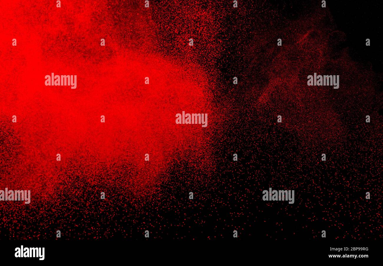 Abstract red powder dust explosion on black background Stock Photo - Alamy