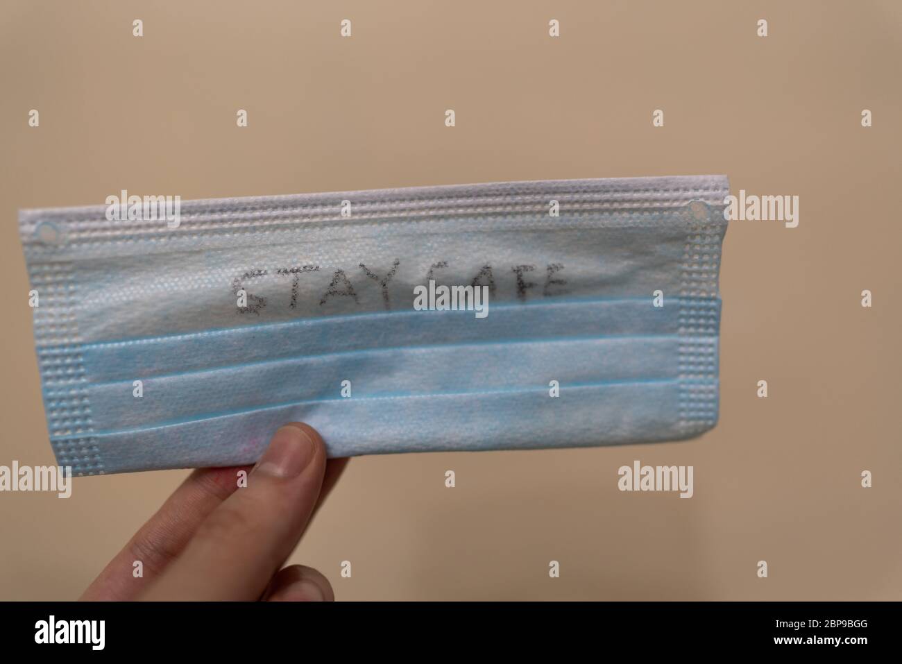 Face mask with a personal handwritten message 'stay safe' | virus ...