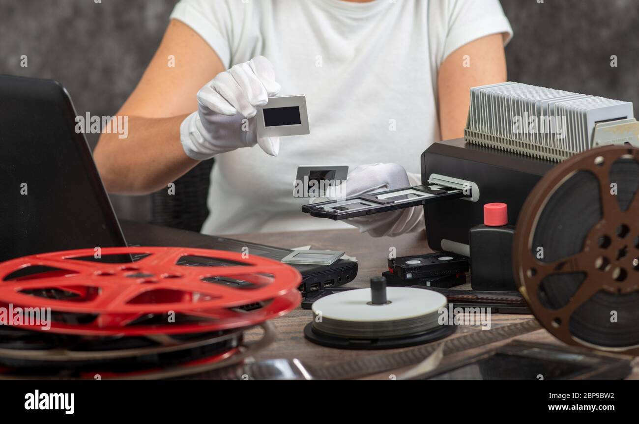 close up hand photographer digitize film slide for saving Stock Photo ...