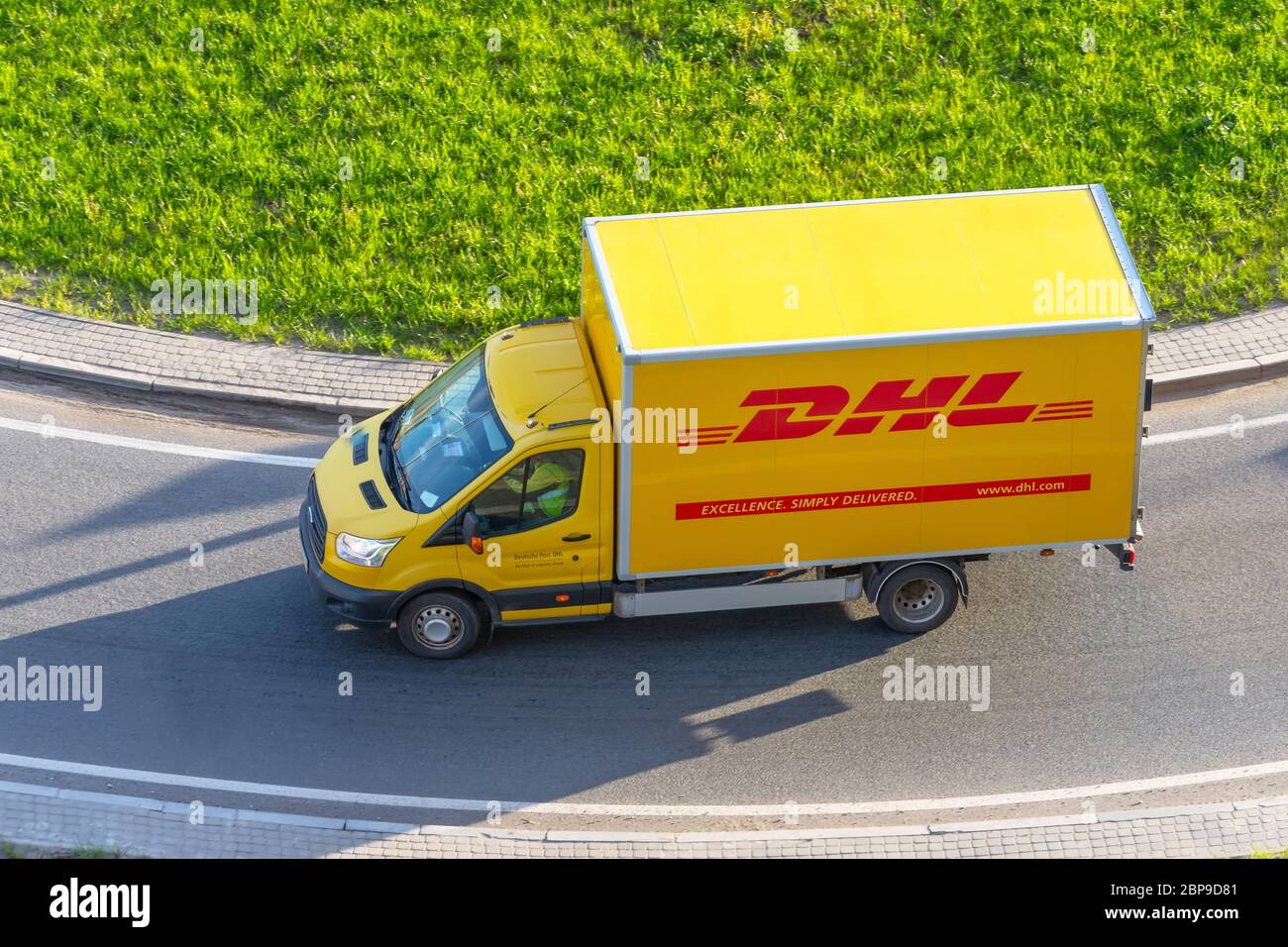 DHL world wide courier company delivery truck on the highway city ...
