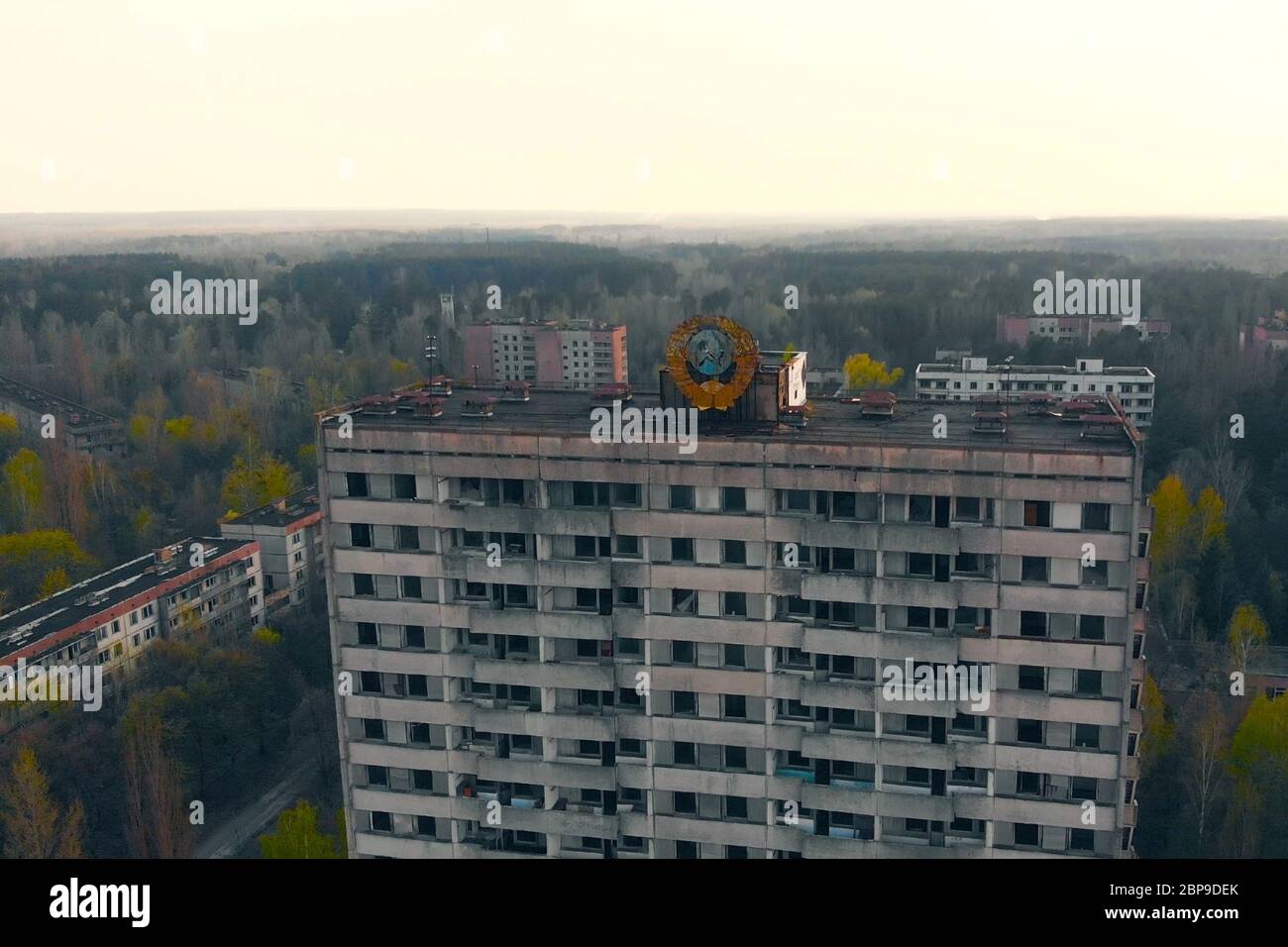 Soviet coat of arms on a high-rise building in Pripyat. City of Pripyt ...