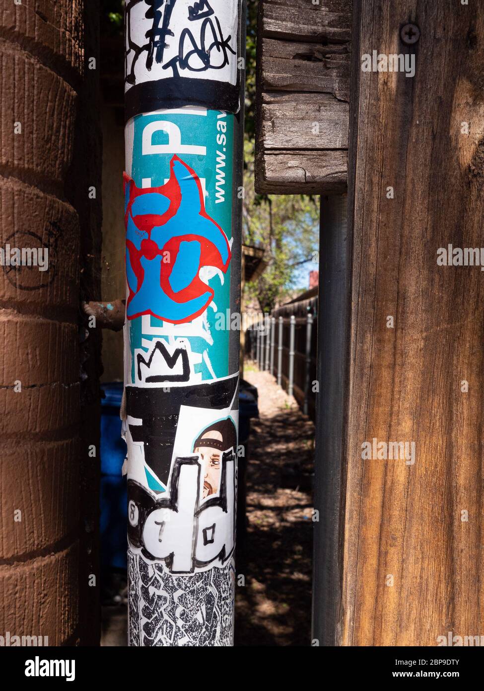 Stickers on an outdoor pole Stock Photo - Alamy