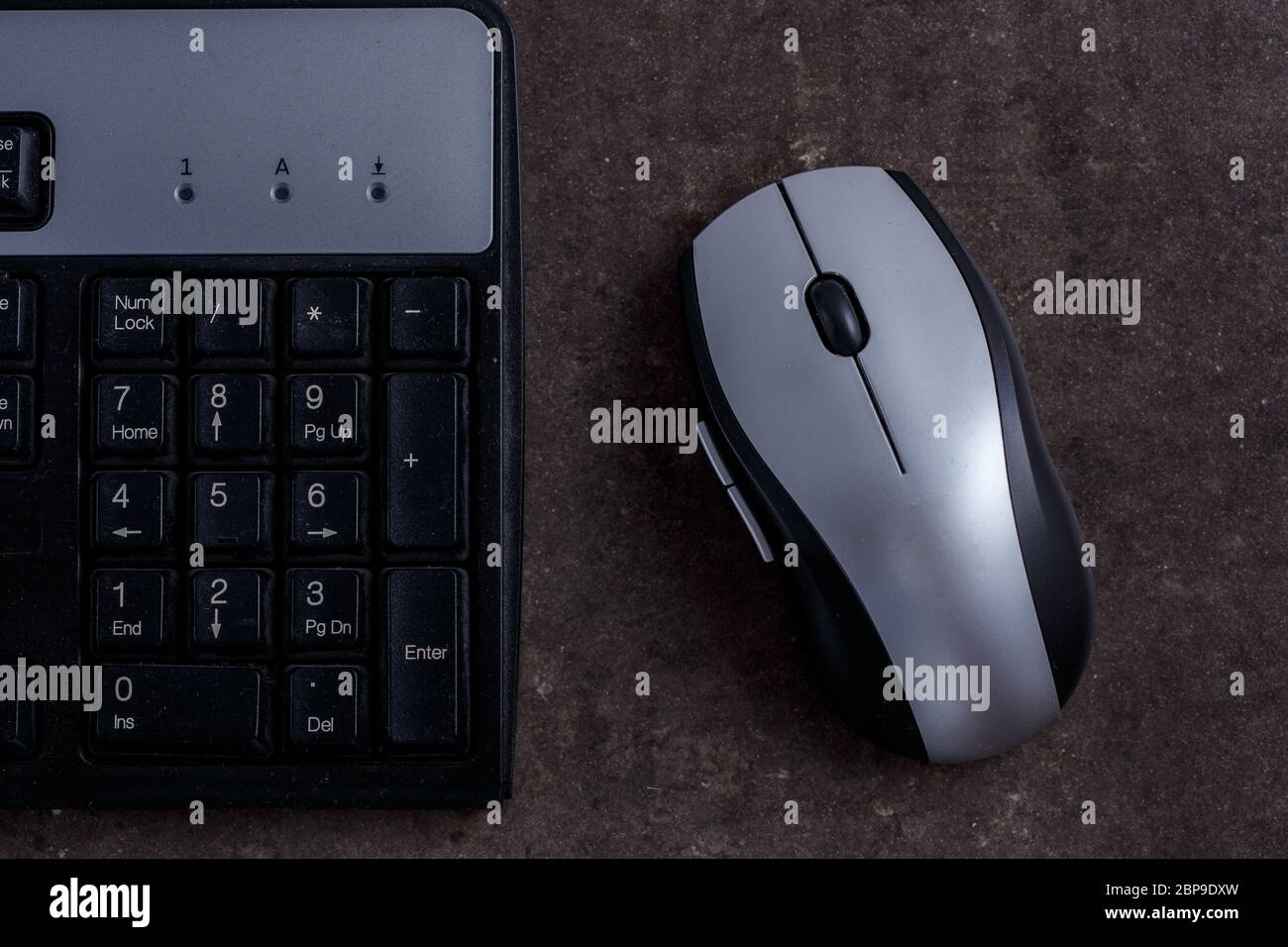 black keyboard and black and grey computer mouse on grey marble Stock ...