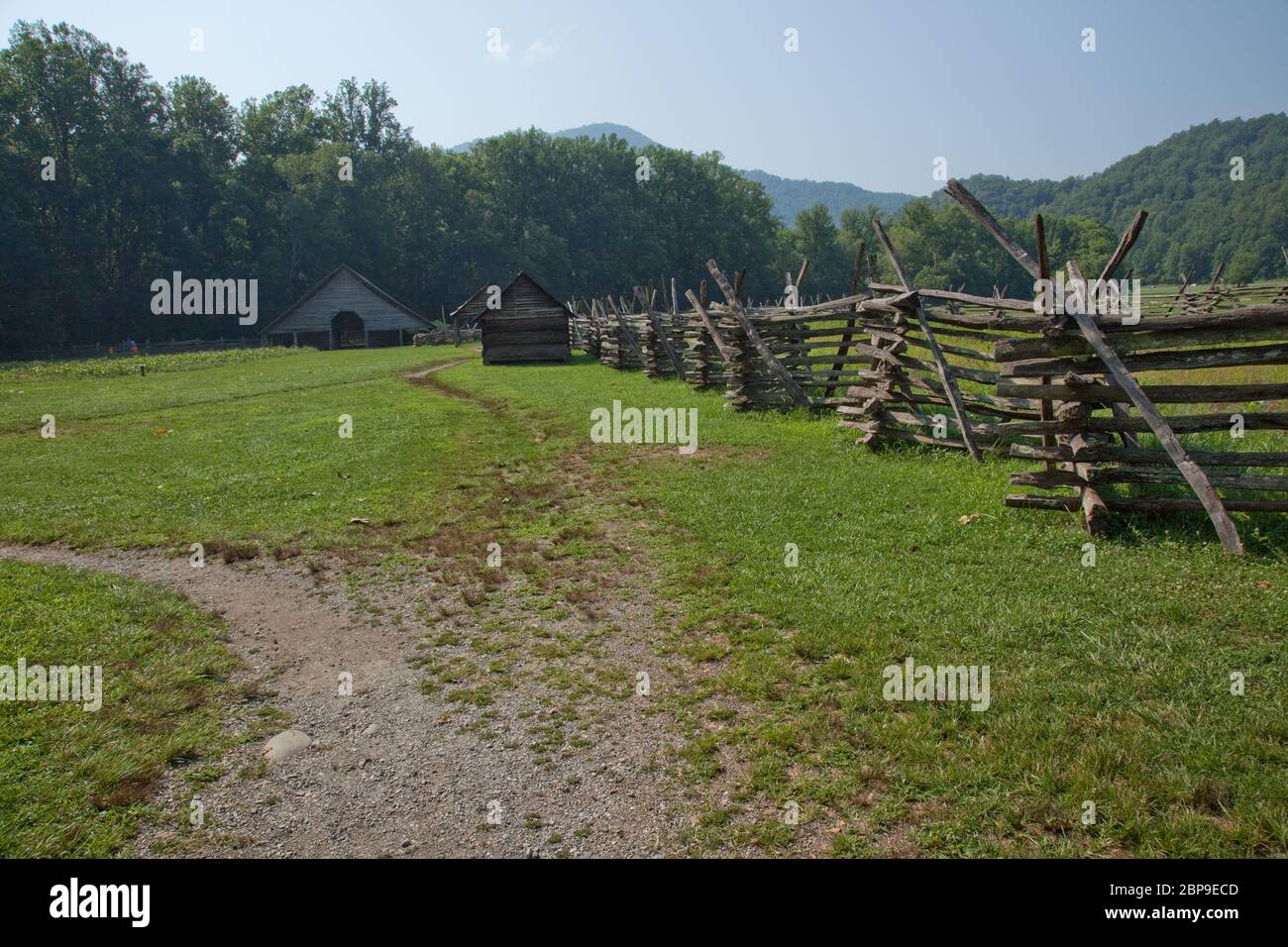 Path by a rail fence Stock Photo - Alamy