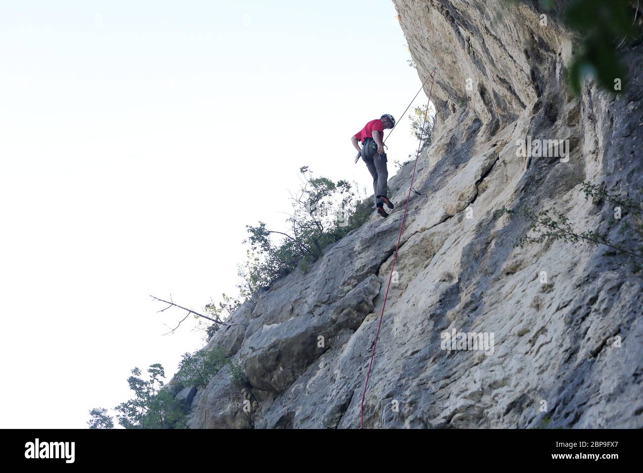 Man abseiling on mountain hi-res stock photography and images - Alamy