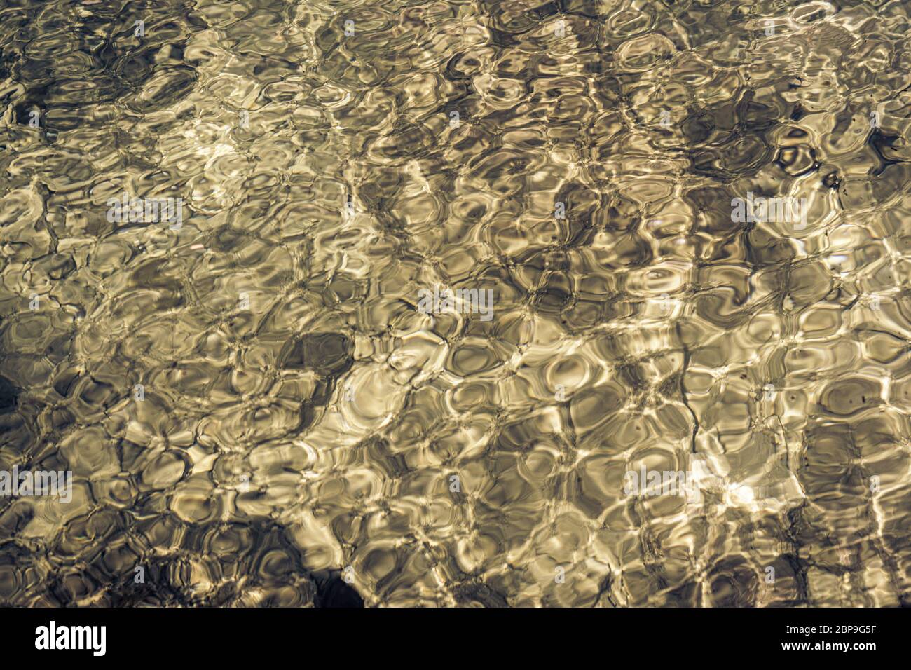 Abstract golden colour reflection on a sea water surface Stock Photo ...