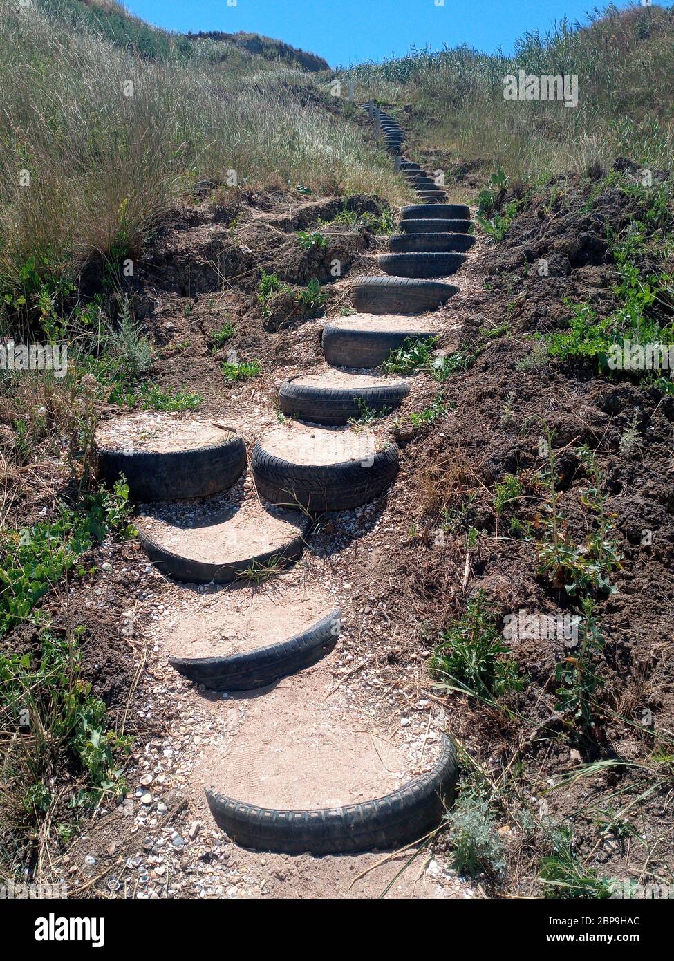 Steps to the top of the hill, made of car treads. Creative from old car ...