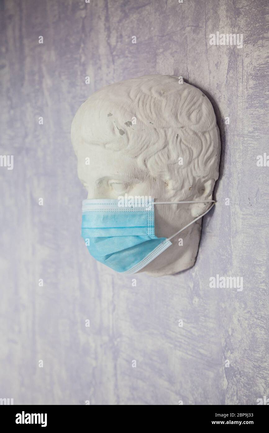 Blue protective medical mask worn on an old Roman statue Stock Photo ...