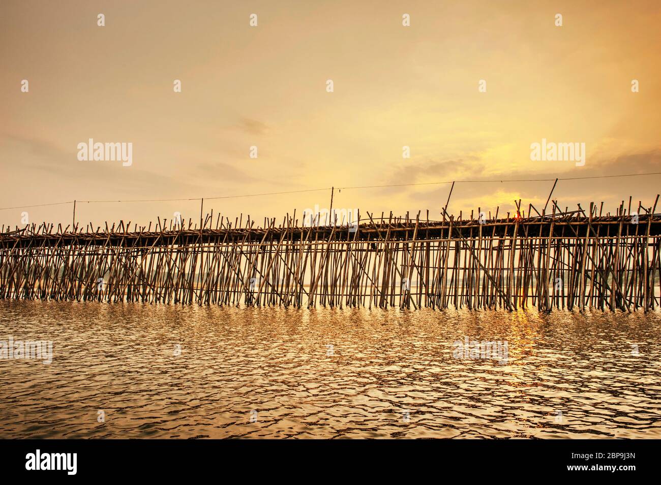 Bamboo bridge over the Mekong River at sunset. Ko Pen, Cambodia ...
