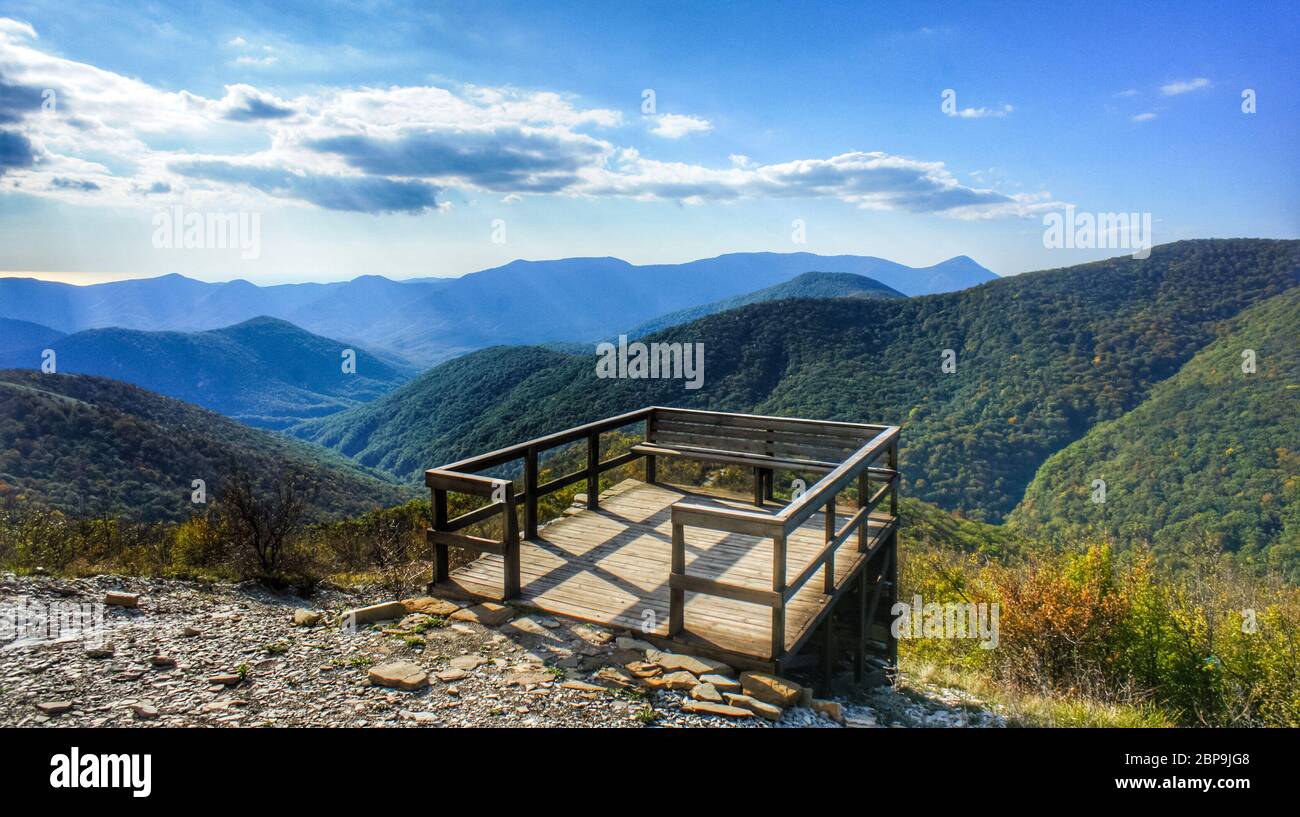 A observation deck made of wood in the mountains. The beginning of the ...