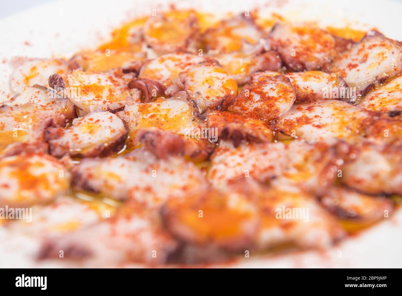 Typical Galician dish of fair style octopus with red pepper Stock Photo ...