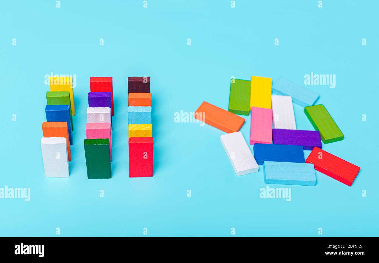 order and chaos. Chaotic unorganized colored dominoes and ordered ...