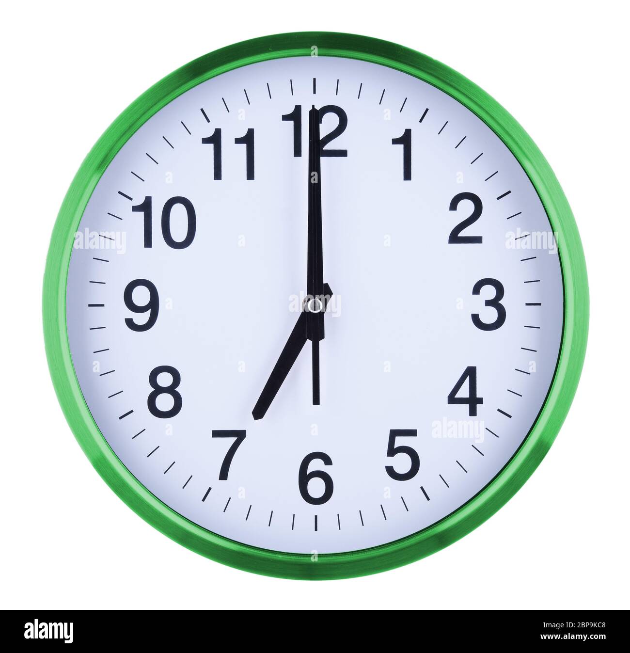 Wall clock isolated on white background. Seven oclock Stock Photo - Alamy