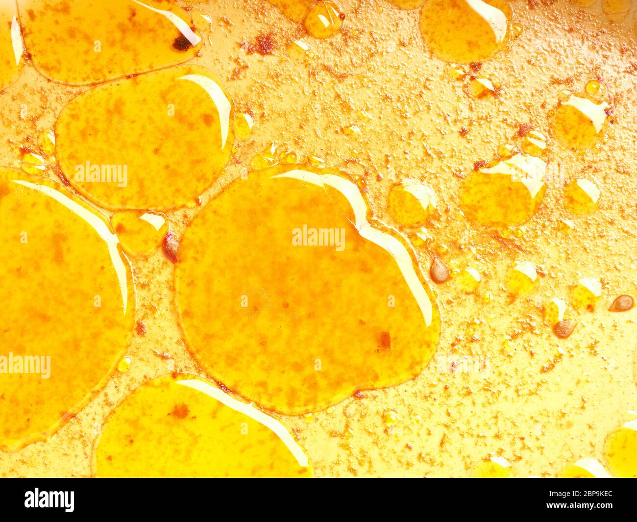 Close up of grease eyes in the baking dish using as background Stock ...