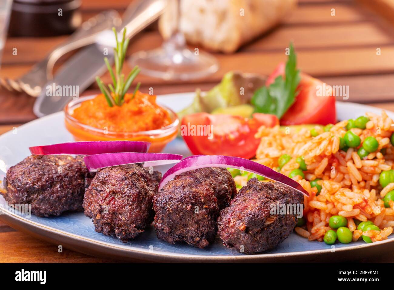 closeup of cevapcici with djuvec rice Stock Photo - Alamy