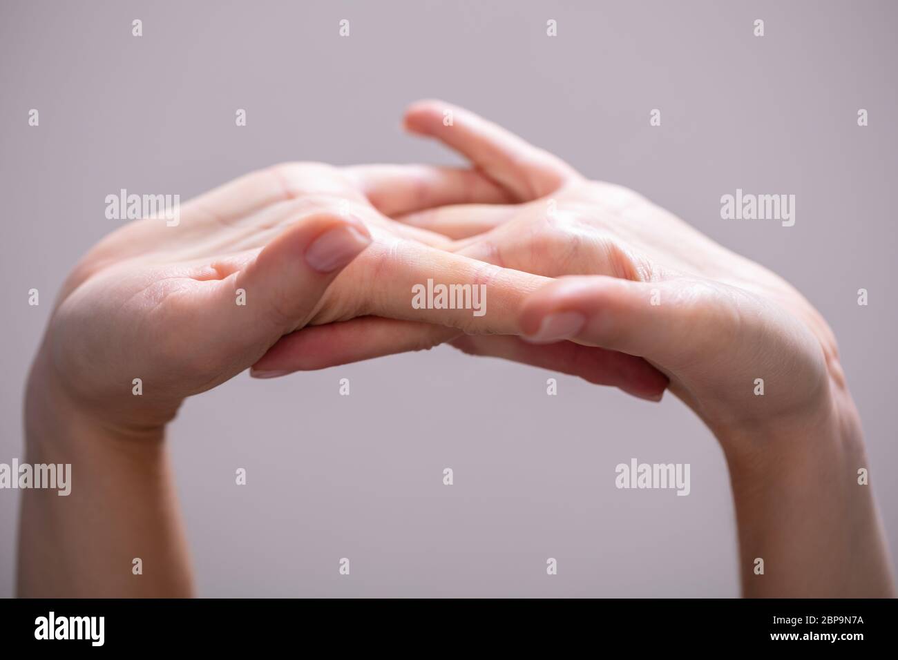 Cracking knuckles hi-res stock photography and images - Alamy