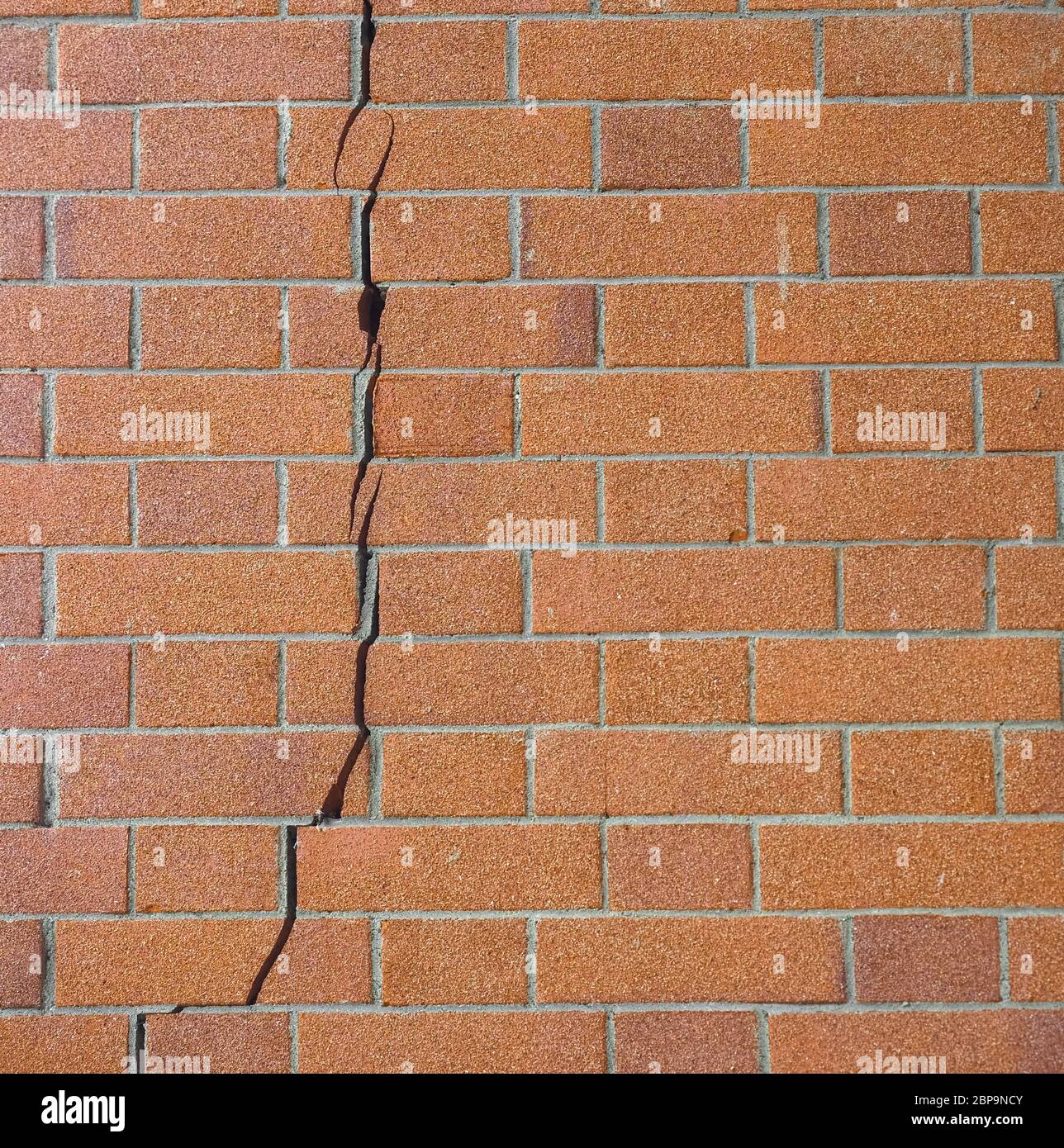 cracked brick wall caused by earthquake or foundation structural ...