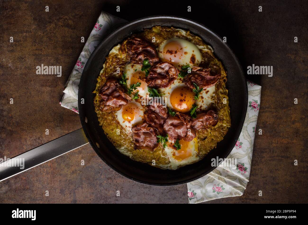 American Hash Browns potato with fried egg, bacon and herbs, real ...
