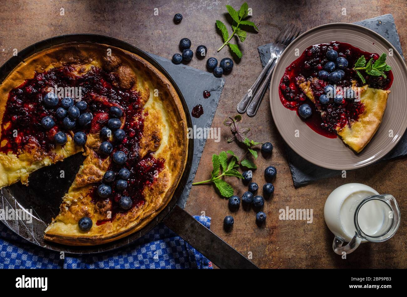 Dutch style pancake named dutch baby, baked in oven on iron skillet ...