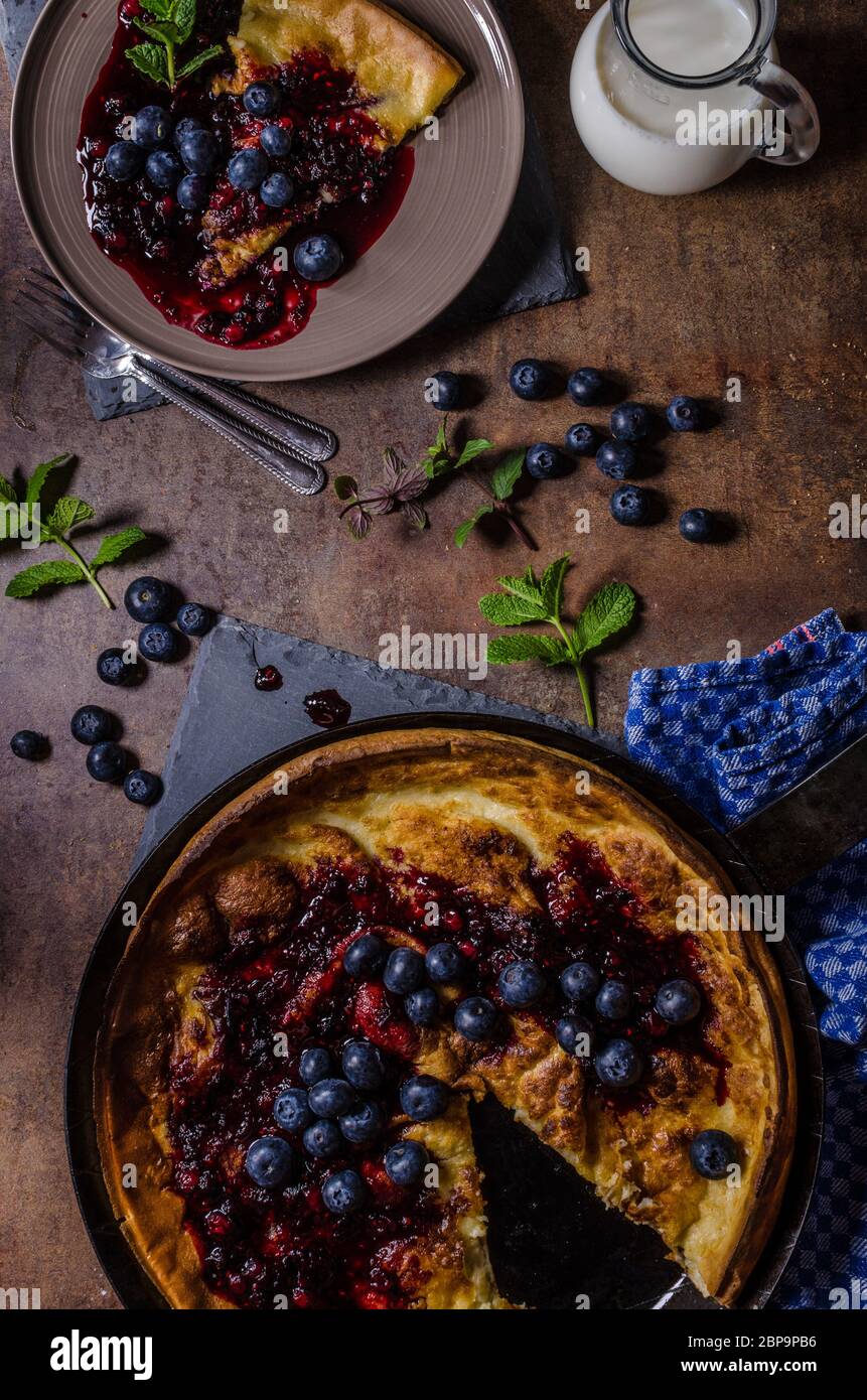 Dutch style pancake named dutch baby, baked in oven on iron skillet ...