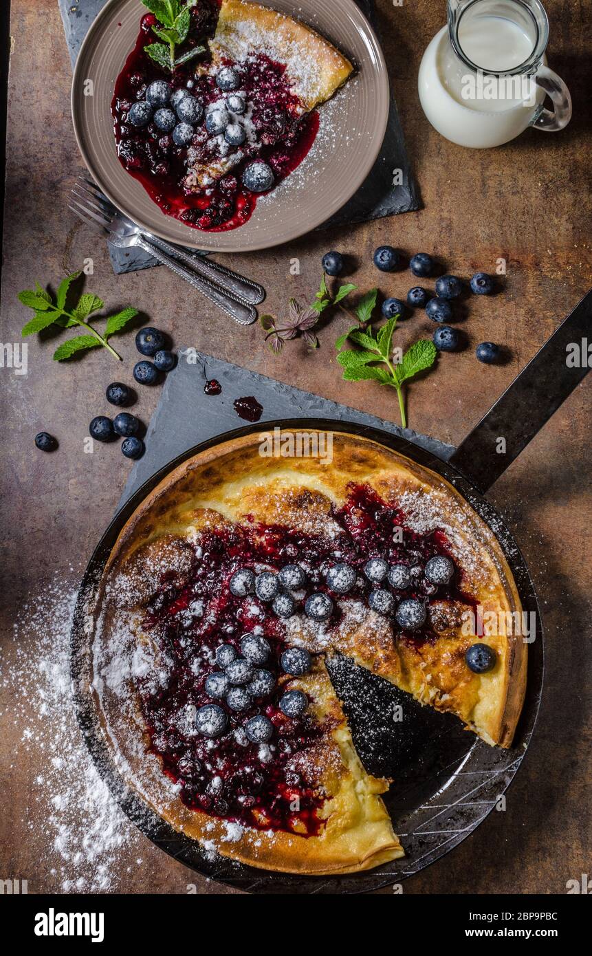 Dutch style pancake named dutch baby, baked in oven on iron skillet ...