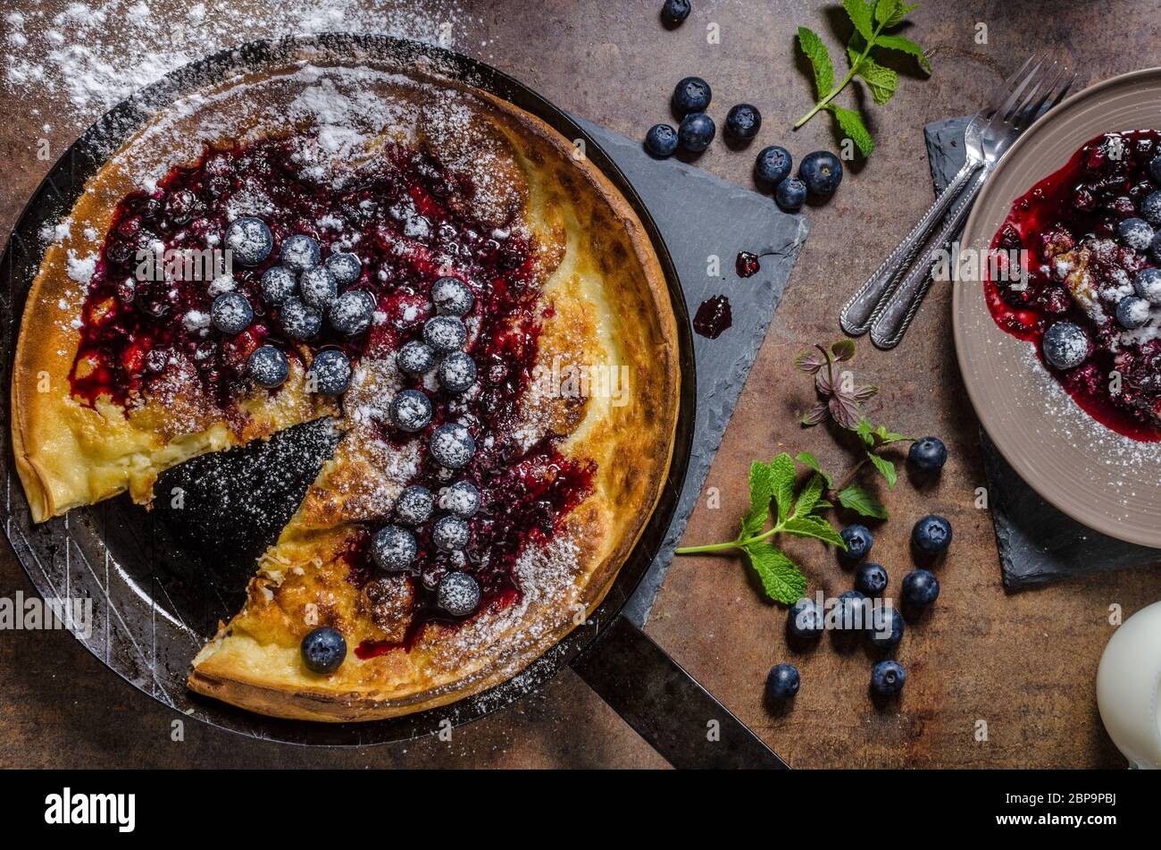Dutch style pancake named dutch baby, baked in oven on iron skillet ...