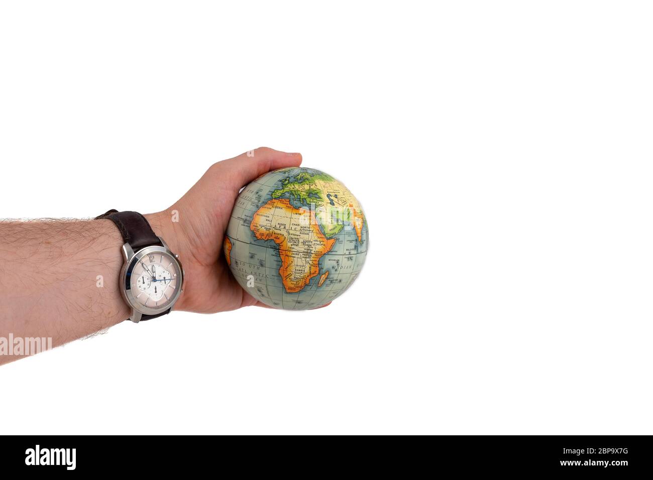 Earth globe in a human hand and the watch shows high time with white ...
