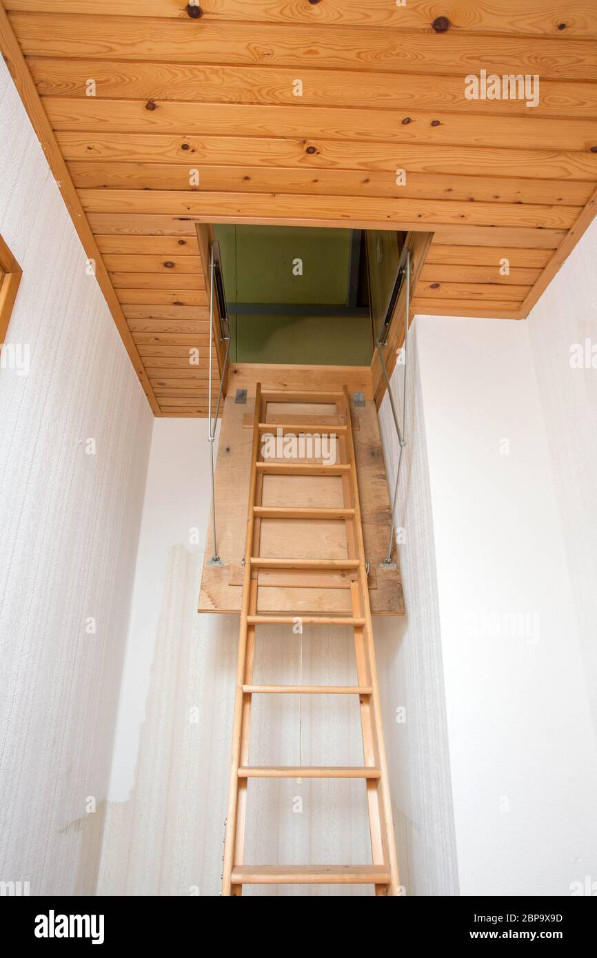 Wooden folding ladder to the attic, old empty house close-up Stock ...
