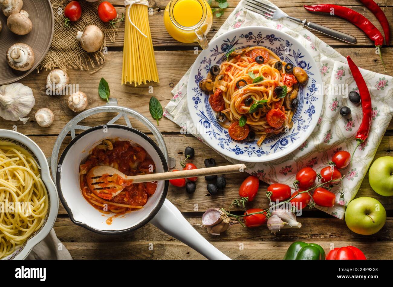 Pasta with olives, tomatoes and basil, fresh pasta, orange juice Stock ...
