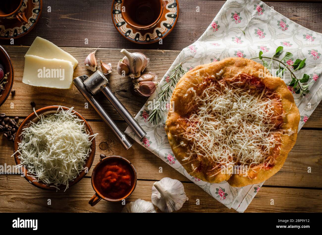 Traditional Langos are originally Hungarian fried pancakes made from ...