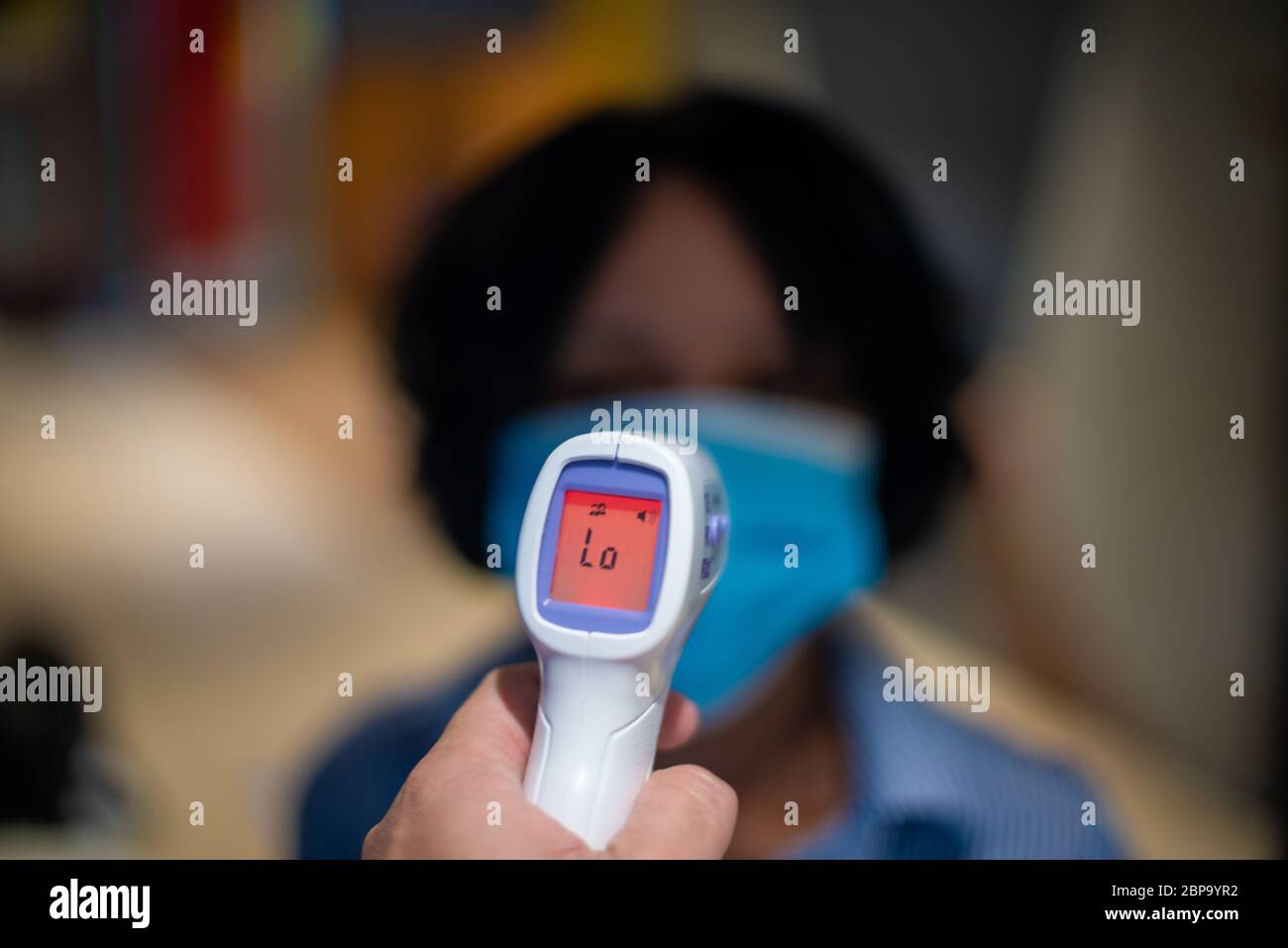 unrecognizable image of person taking a reading from infrared ...