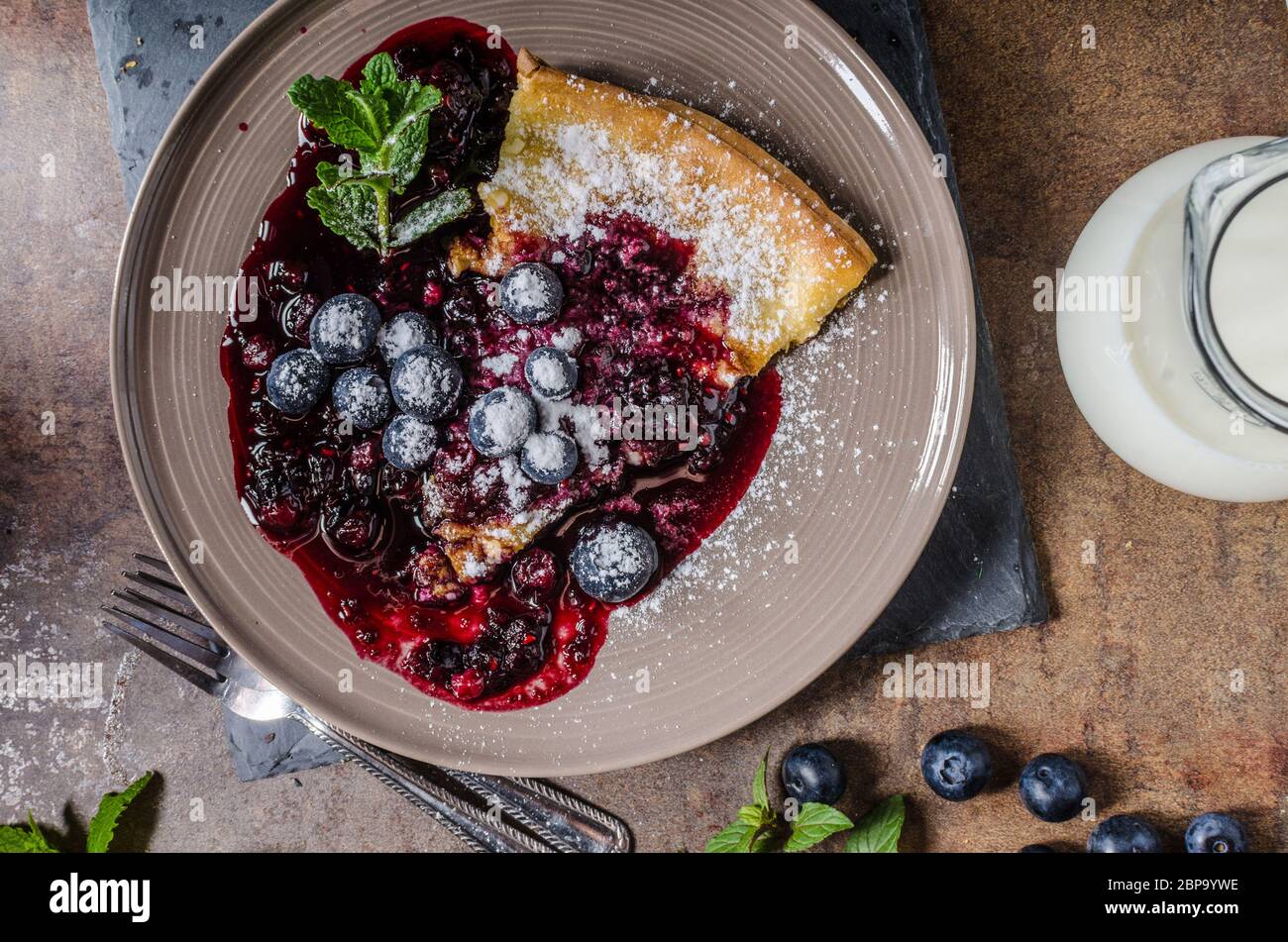 Dutch style pancake named dutch baby, baked in oven on iron skillet ...