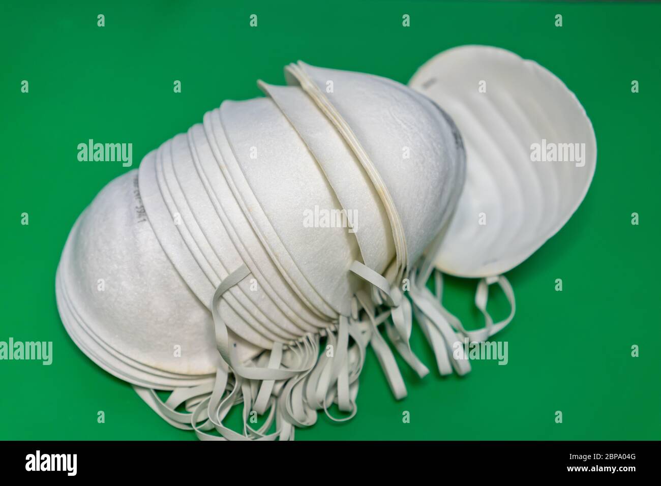 N95 Face Masks on a green background. Multiple stocks of N95 face masks ...