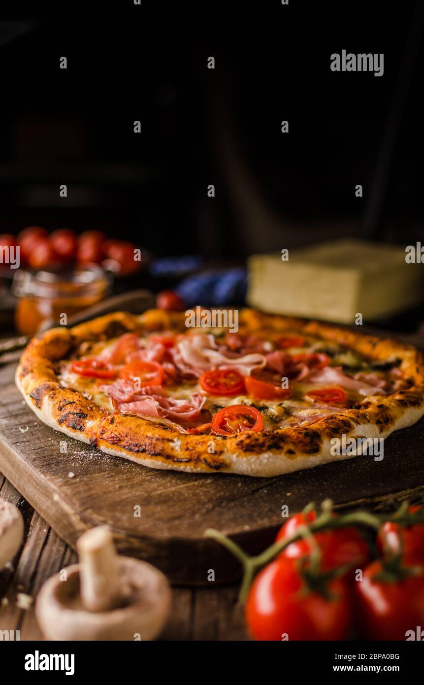 Rustic old style vintage pizza, wood board, fresh food Stock Photo - Alamy
