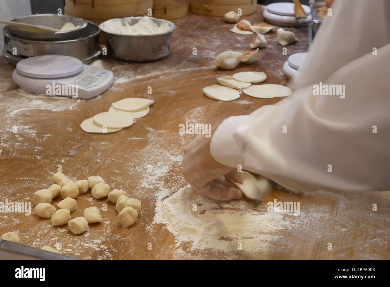 Motion of people are kneading the dough before it to be made dumplings ...