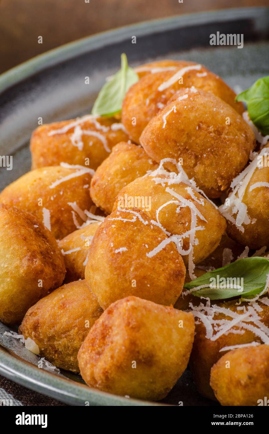 Golden fried mini croquette with parmesan cheese, delicious with tomato ...
