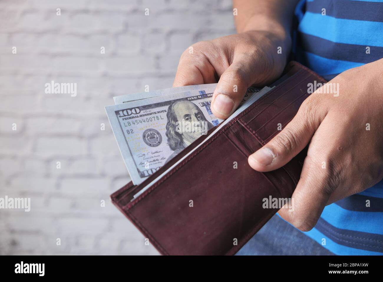 Hand taking money hi-res stock photography and images - Alamy