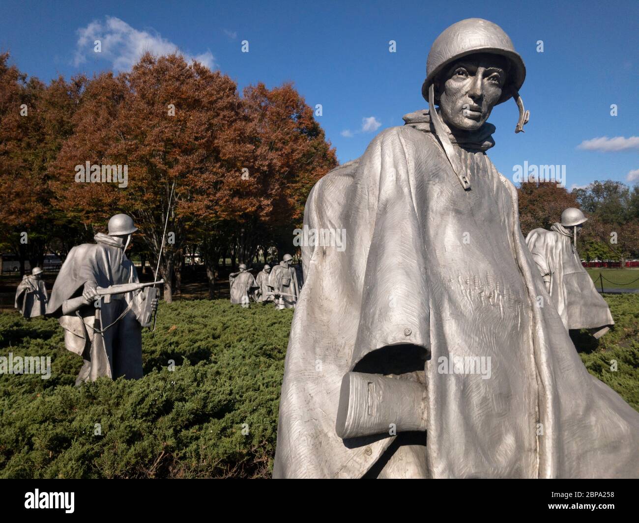 Statues of soldiers march a field at the Koren War Veterans Memorial ...