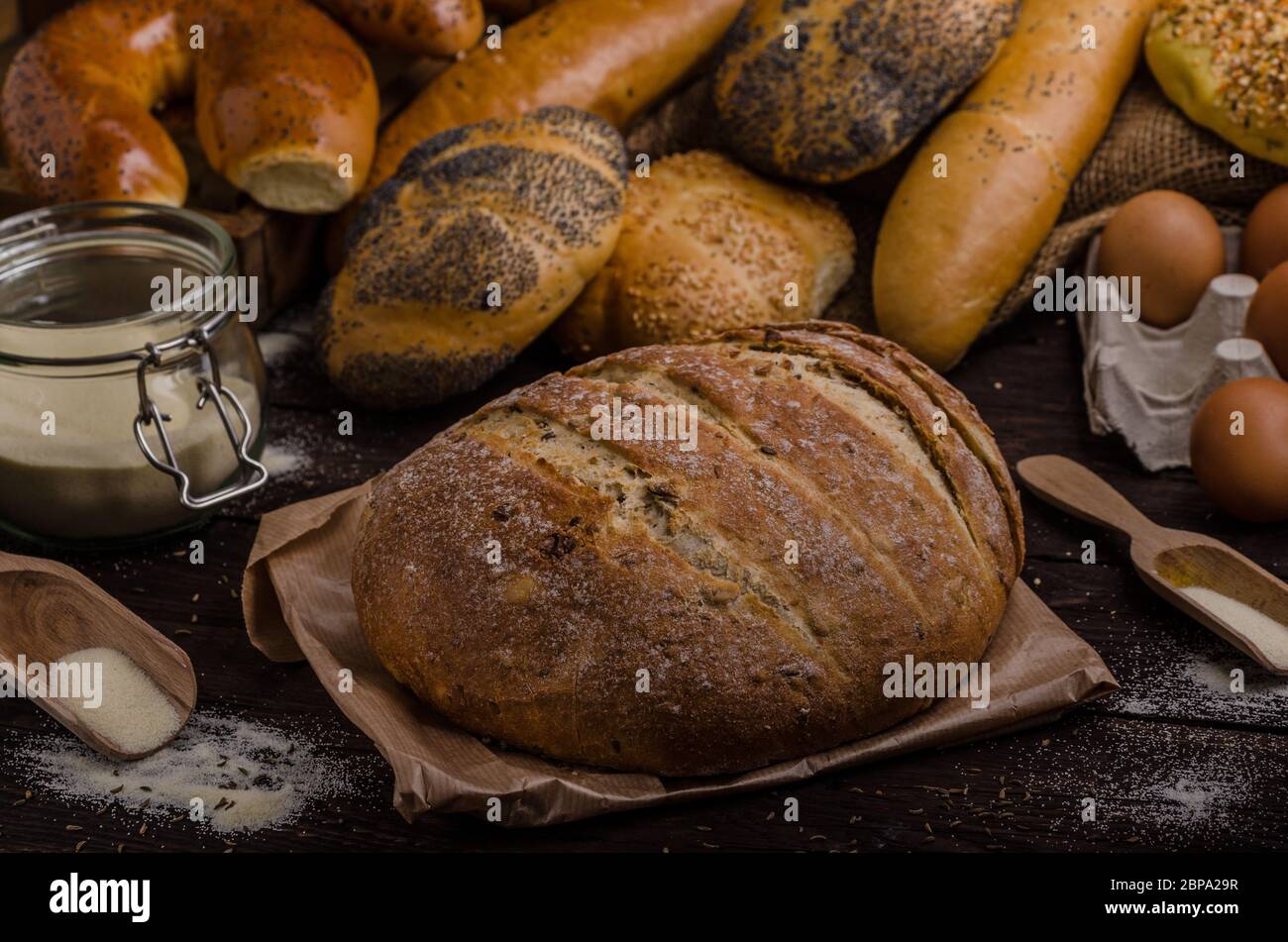 Homemade bread, product photo, selective focus, others pastries behind ...