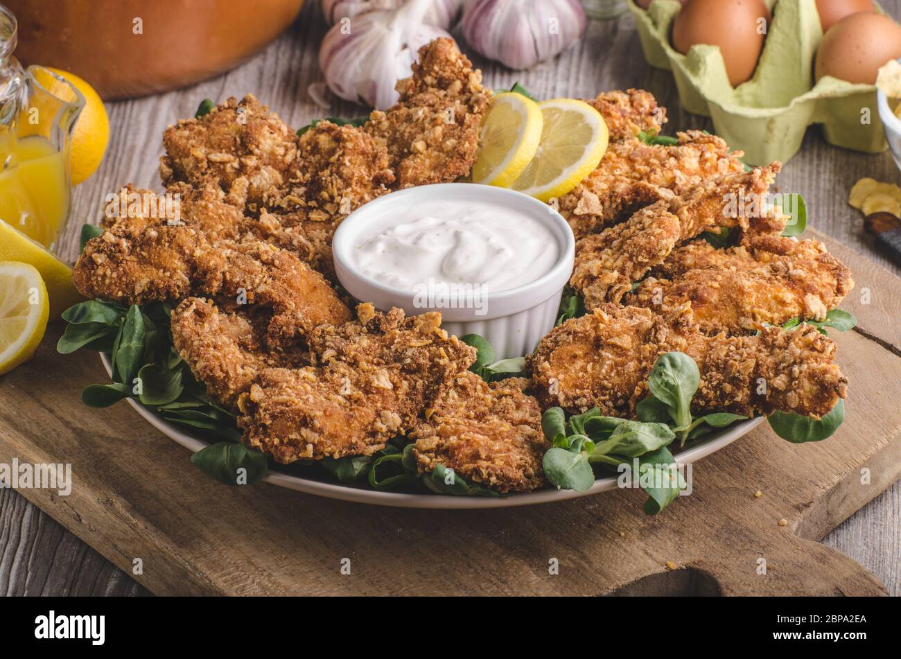 Chicken strips with delish garlic dip, food photography Stock Photo - Alamy