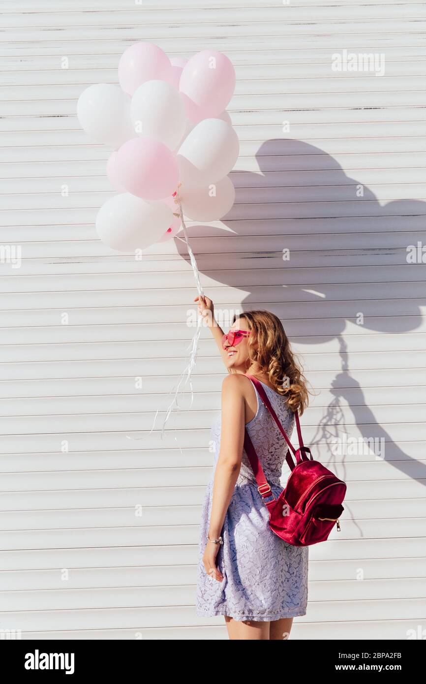 Charming curly woman backpack hi-res stock photography and images - Alamy