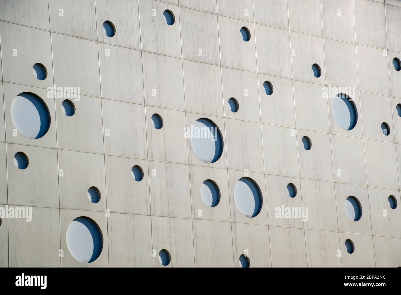 Background texture. A wall with round holes in the form of gas bubbles ...