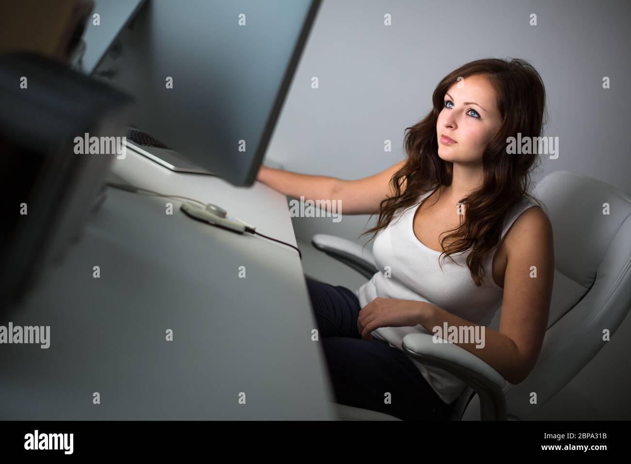 Woman working on a computer in a home office Stock Photo - Alamy