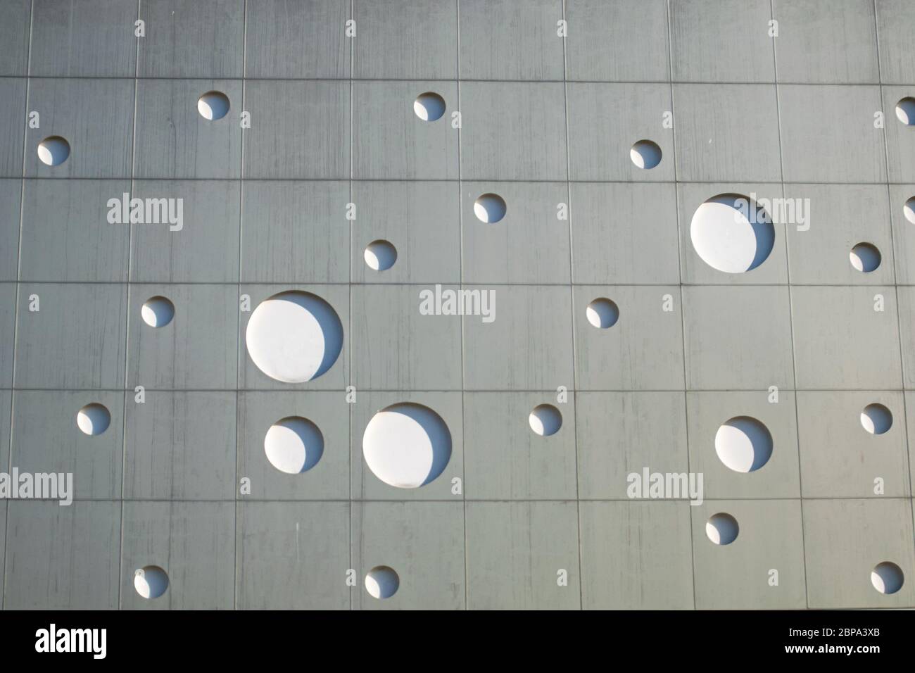 Background texture. A wall with round holes in the form of gas bubbles ...