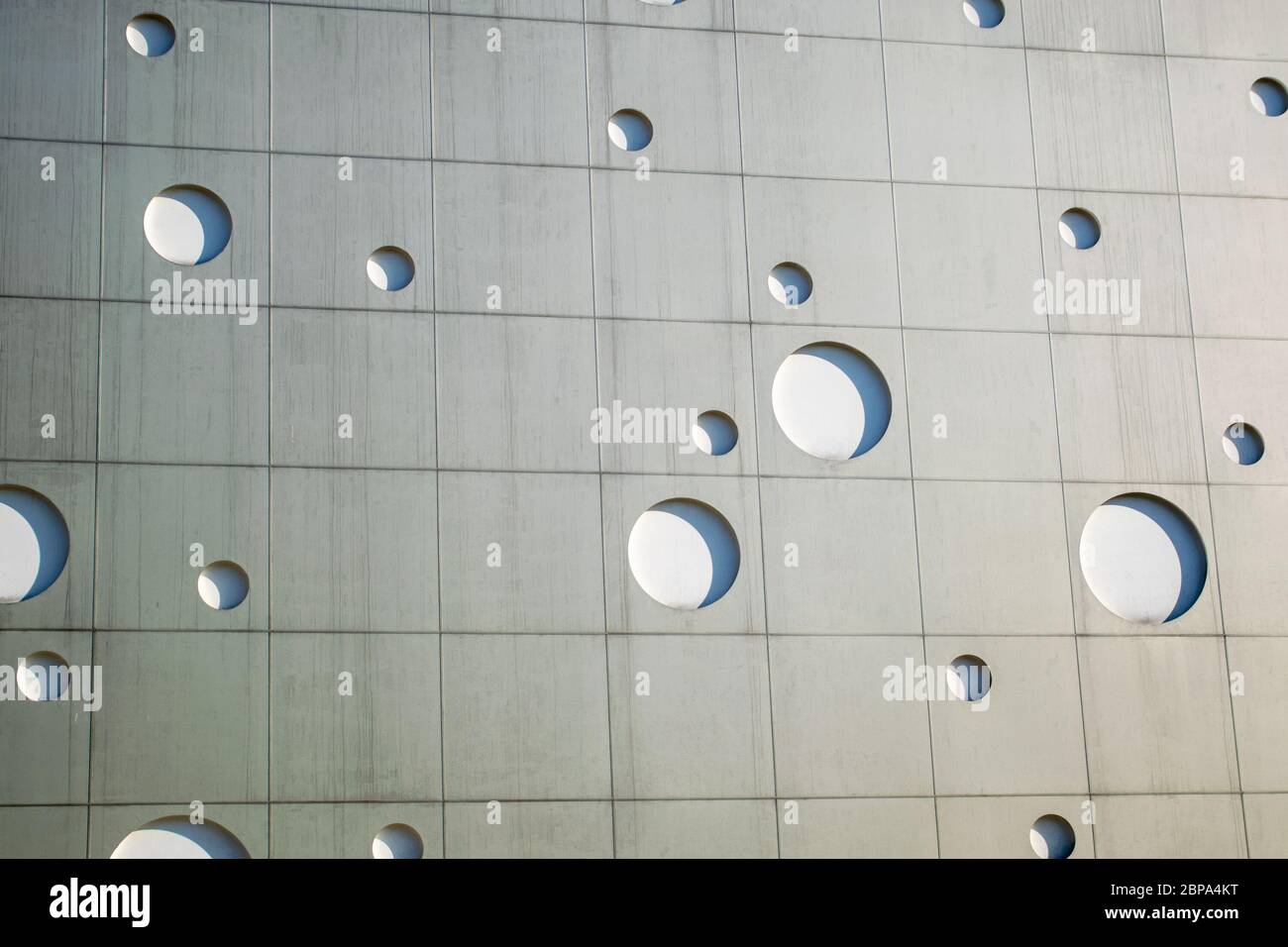 Background texture. A wall with round holes in the form of gas bubbles ...