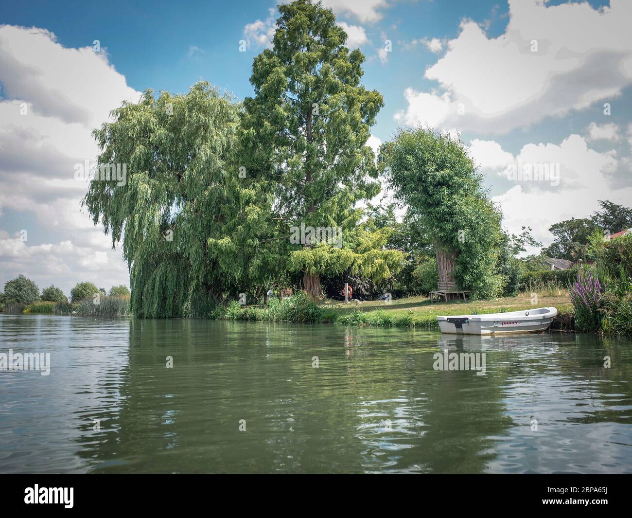 A river boat on the Upper River Thames near the Cotswolds in ...